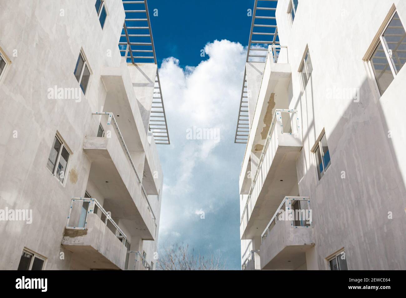A low angle shot of two minimalistic residential buildings built ...