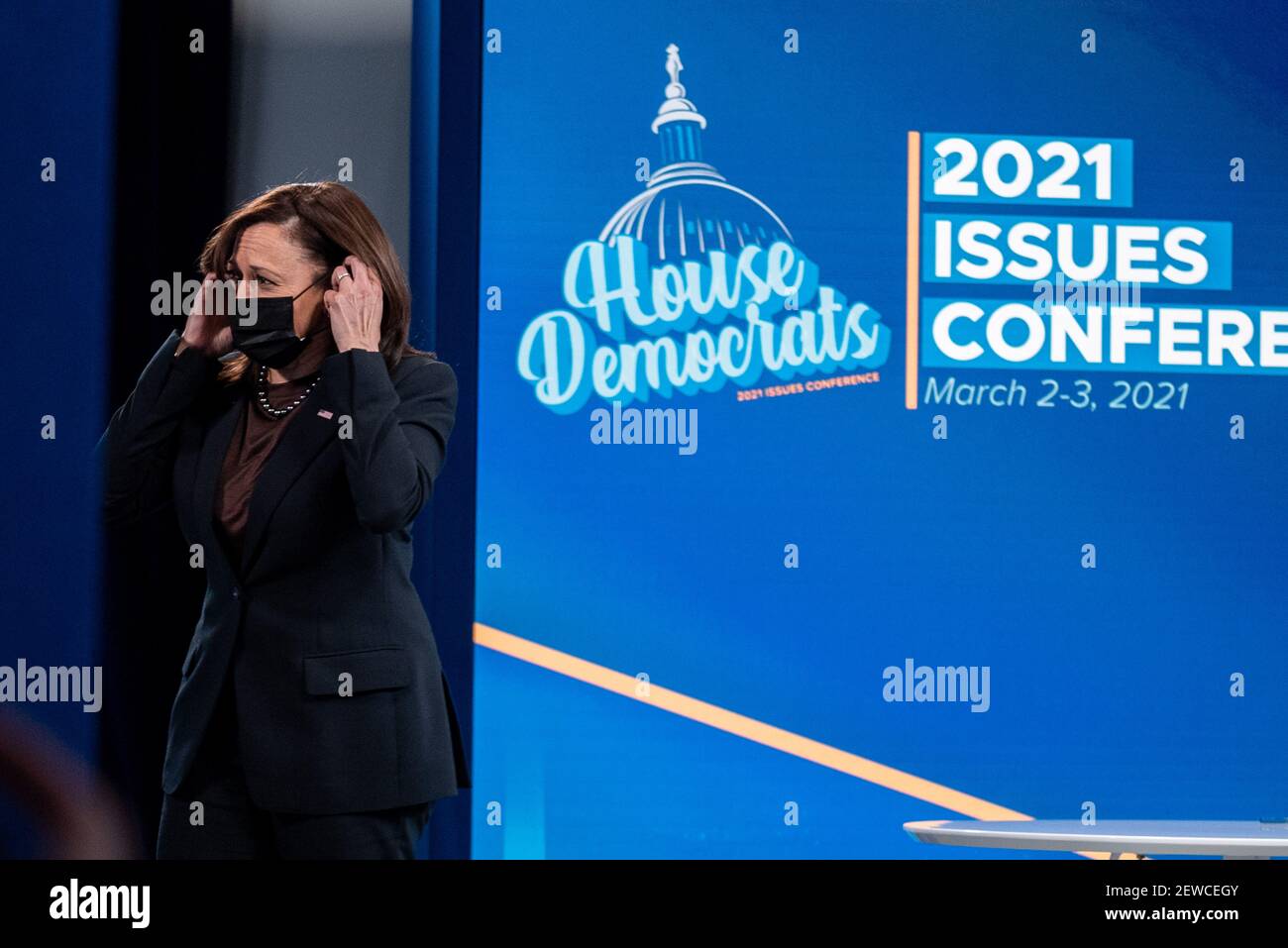 United States Vice President Kamala Harris places her protective mask ...