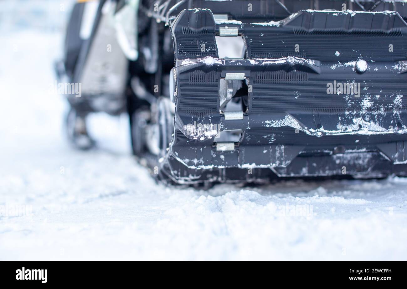 The back of the snowmobile in winter. Riding in the snow on a ...
