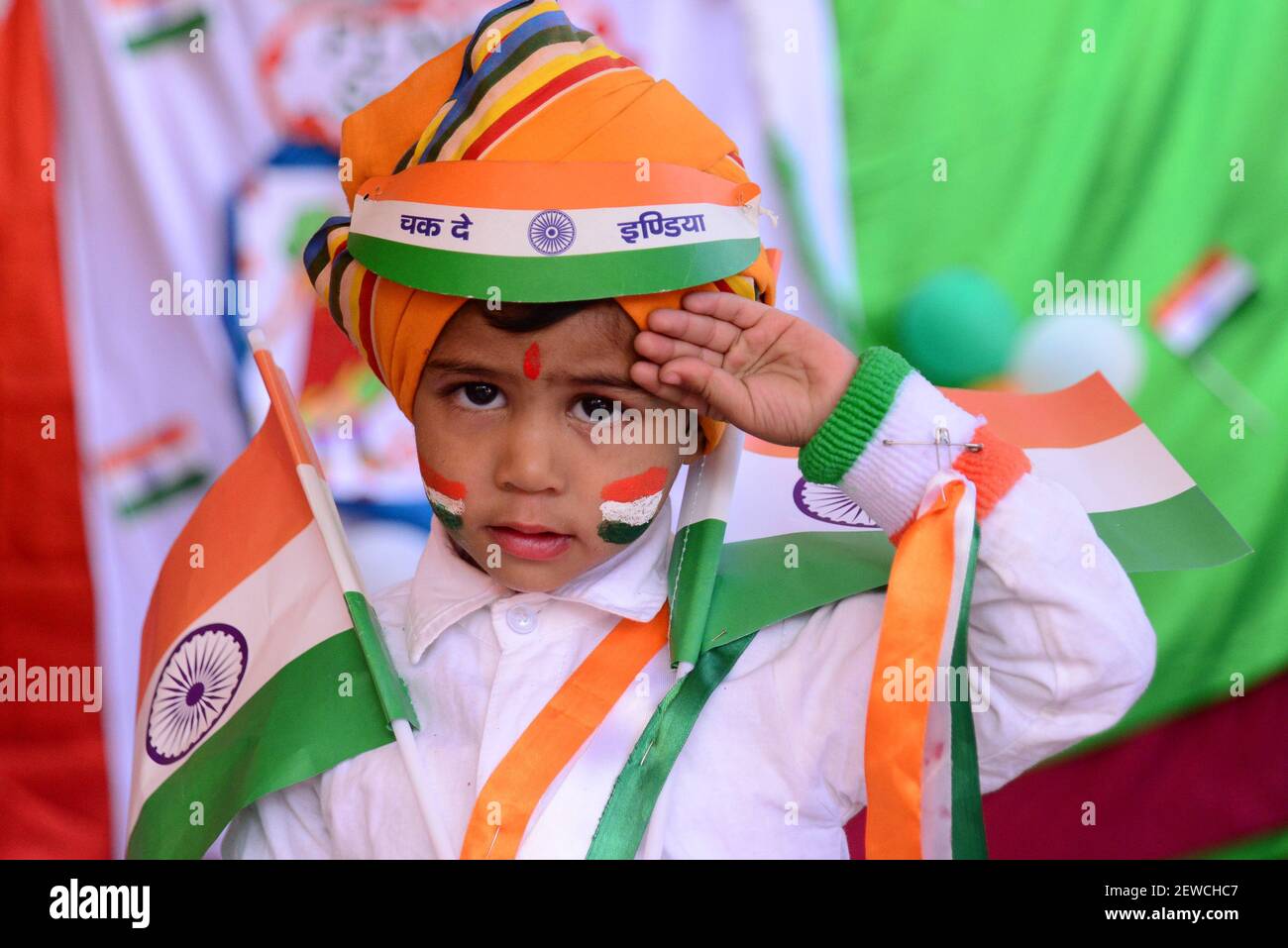 Indian children paint the tricolor of Indian flag on their face and ...