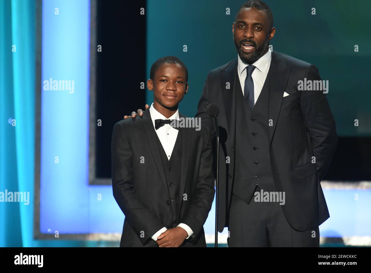Abraham Attah (left) and Idris Elba present the film clip for 'Beasts ...