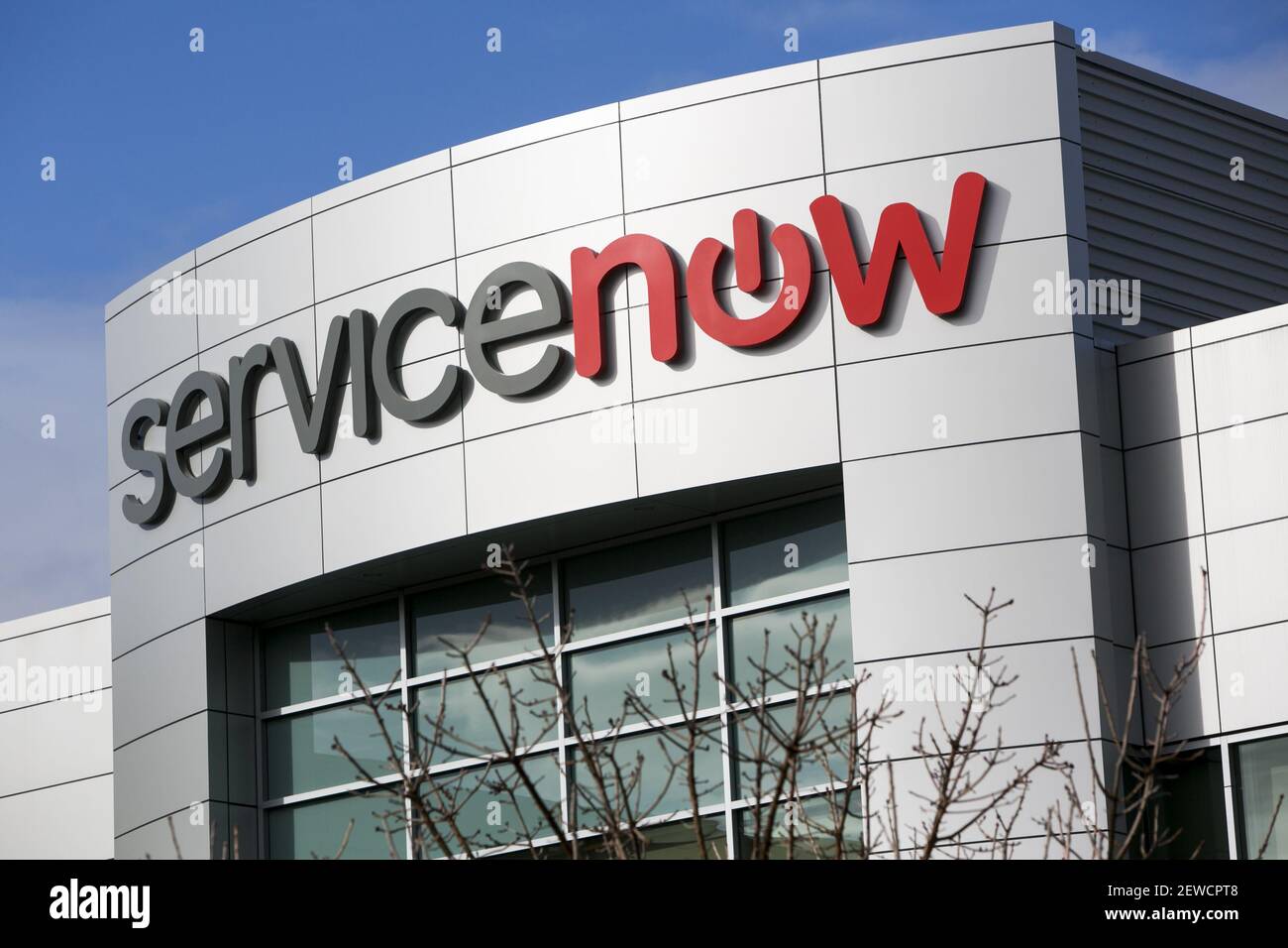 A logo sign outside of the headquarters of ServiceNow in Santa Clara ...
