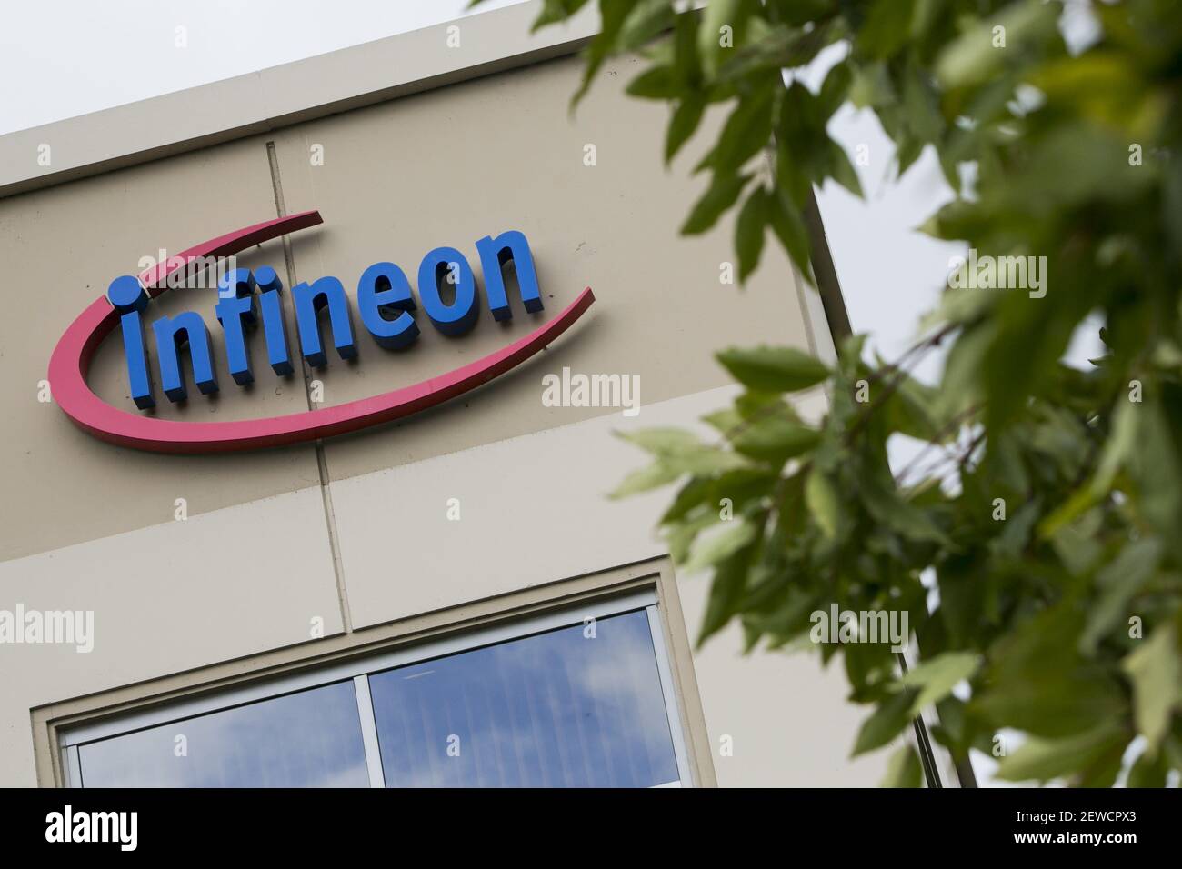 A logo sign outside of a facility occupied by Infineon Technologies in ...