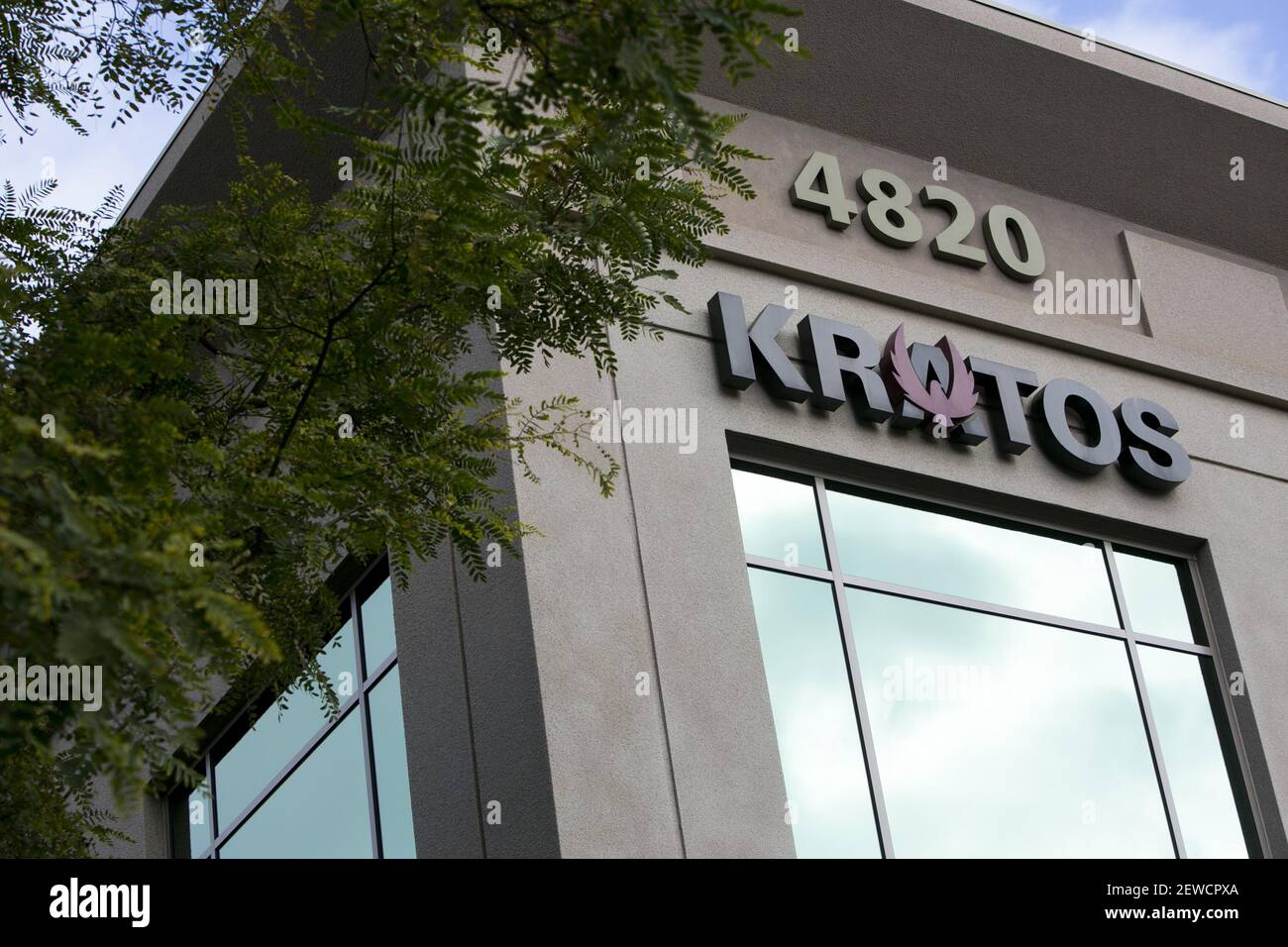 A logo sign outside of the headquarters of Kratos in San Diego ...