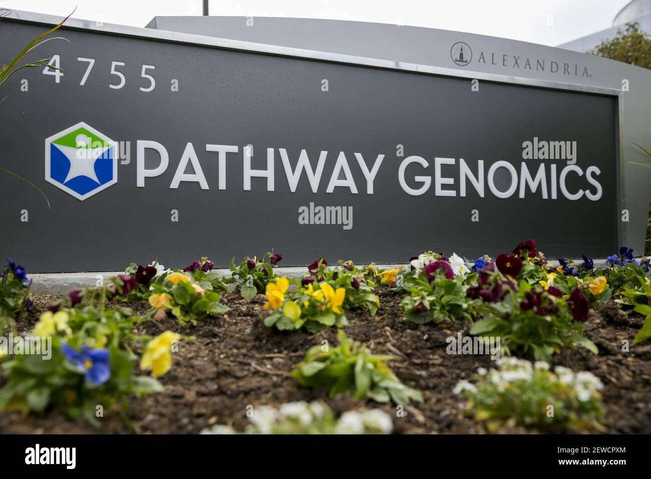 A logo sign outside of the headquarters of Pathway Genomics in San ...