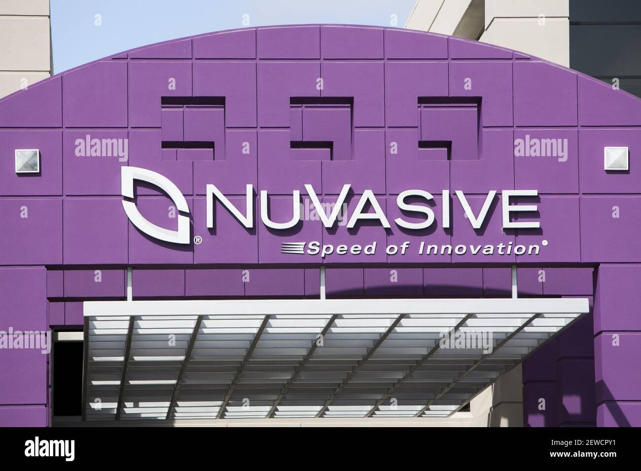 A logo sign outside of the headquarters of NuVasive, Inc., in San Diego ...