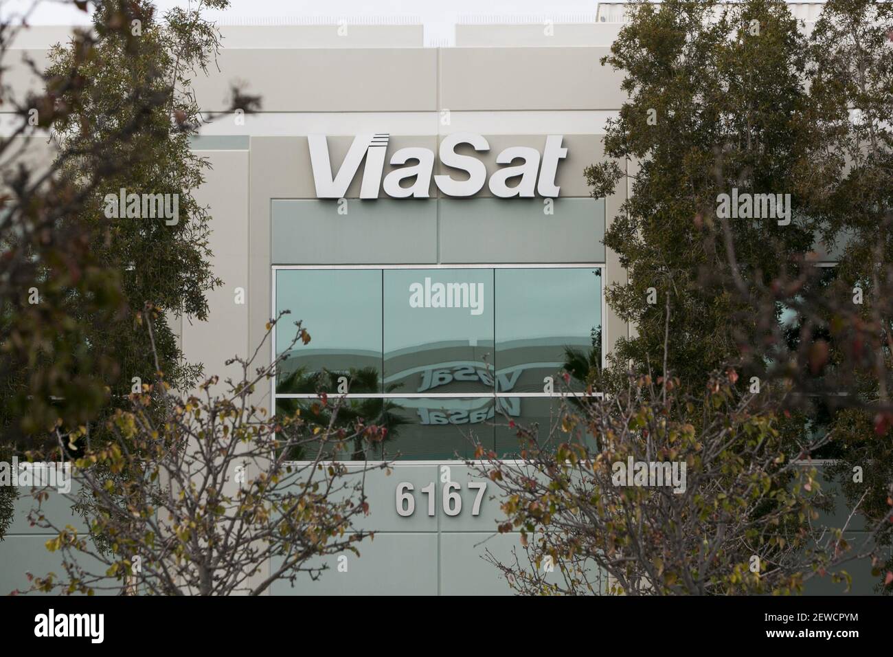 A logo sign outside of the headquarters of ViaSat Inc., in Carlsbad ...
