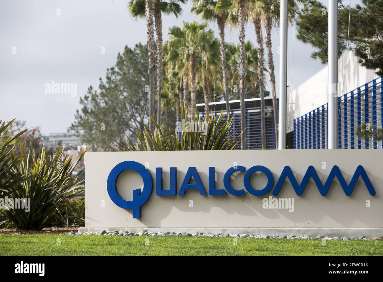 A logo sign outside of a facility occupied by Qualcomm in San Diego ...