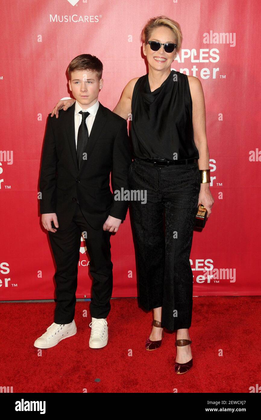 Roan Joseph Bronstein, Sharon Stone attending the 2016 MusiCares Person ...