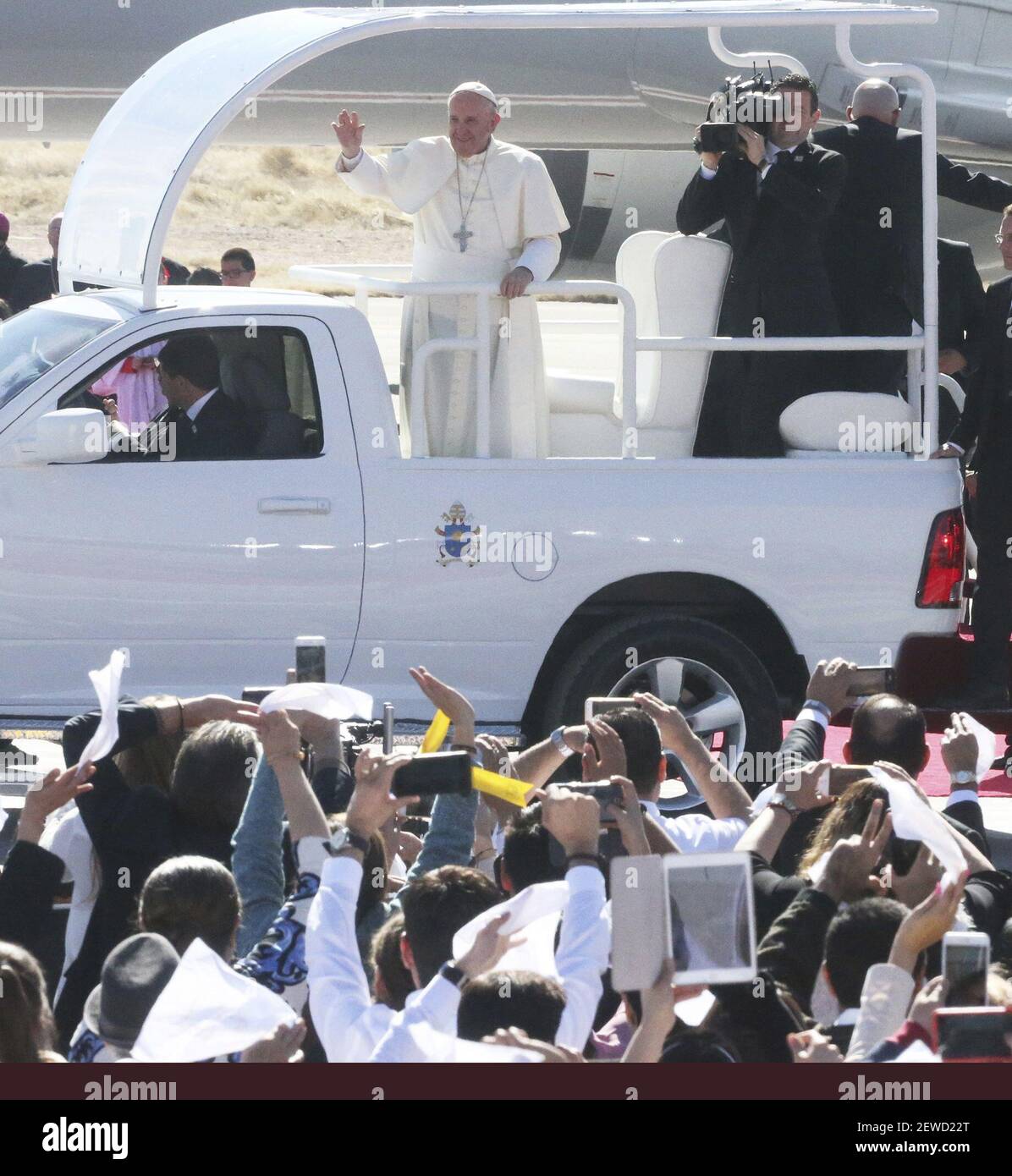Pope Francis blesses the crowd after boarding his Popemobile at Abraham ...
