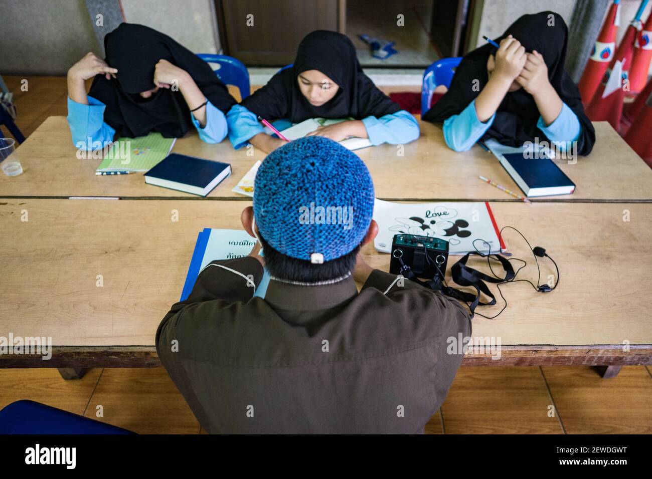 Muslim girls studying English at a mosque in the Khlongtoey district of ...