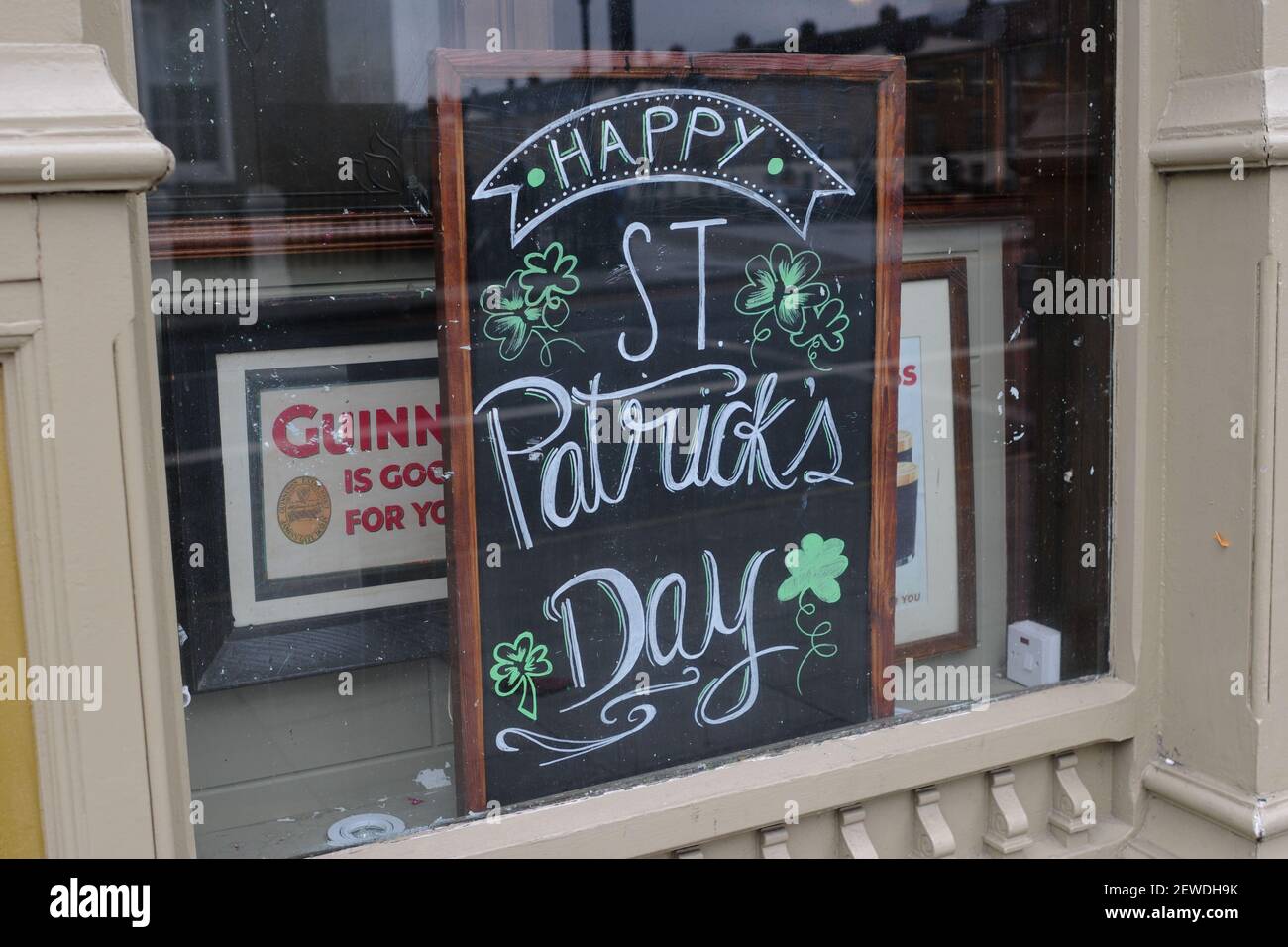 St Patrick's Day wishes on display in a pub shop window in the build up ...