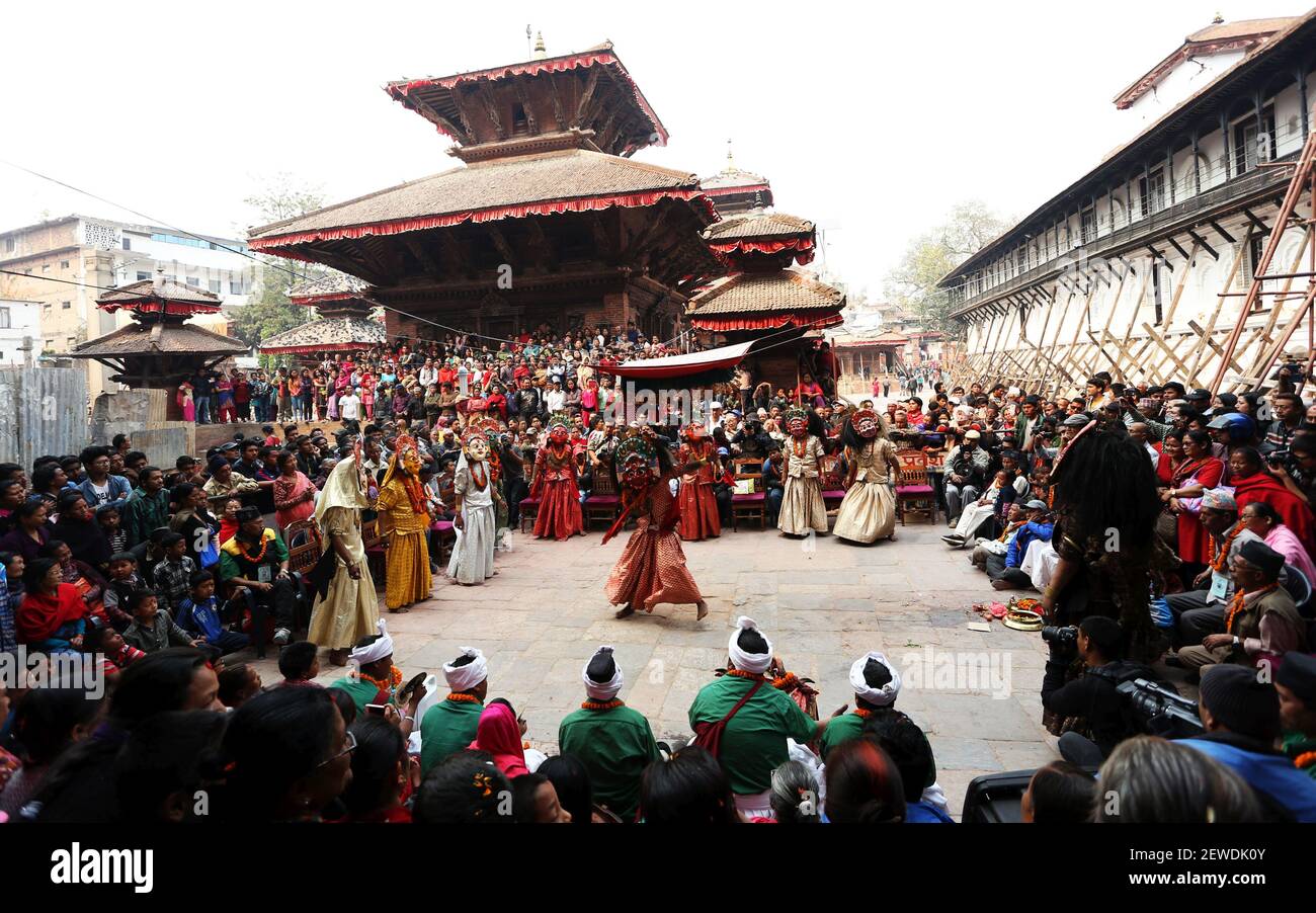 Hindu devotees dress up as various deities perform during a religious ...