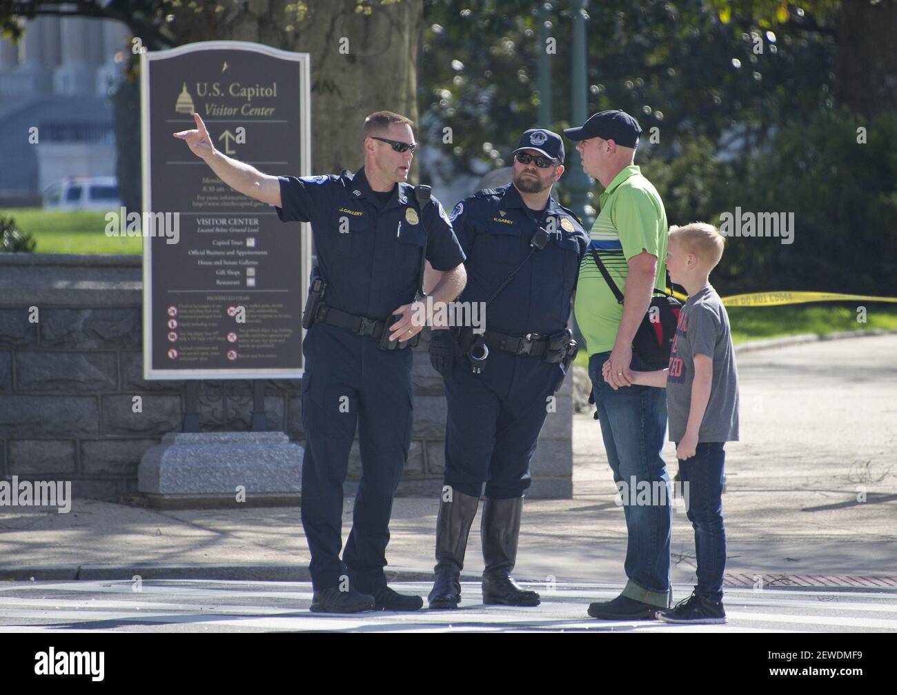 A United States Capitol police officer directs people around the US ...