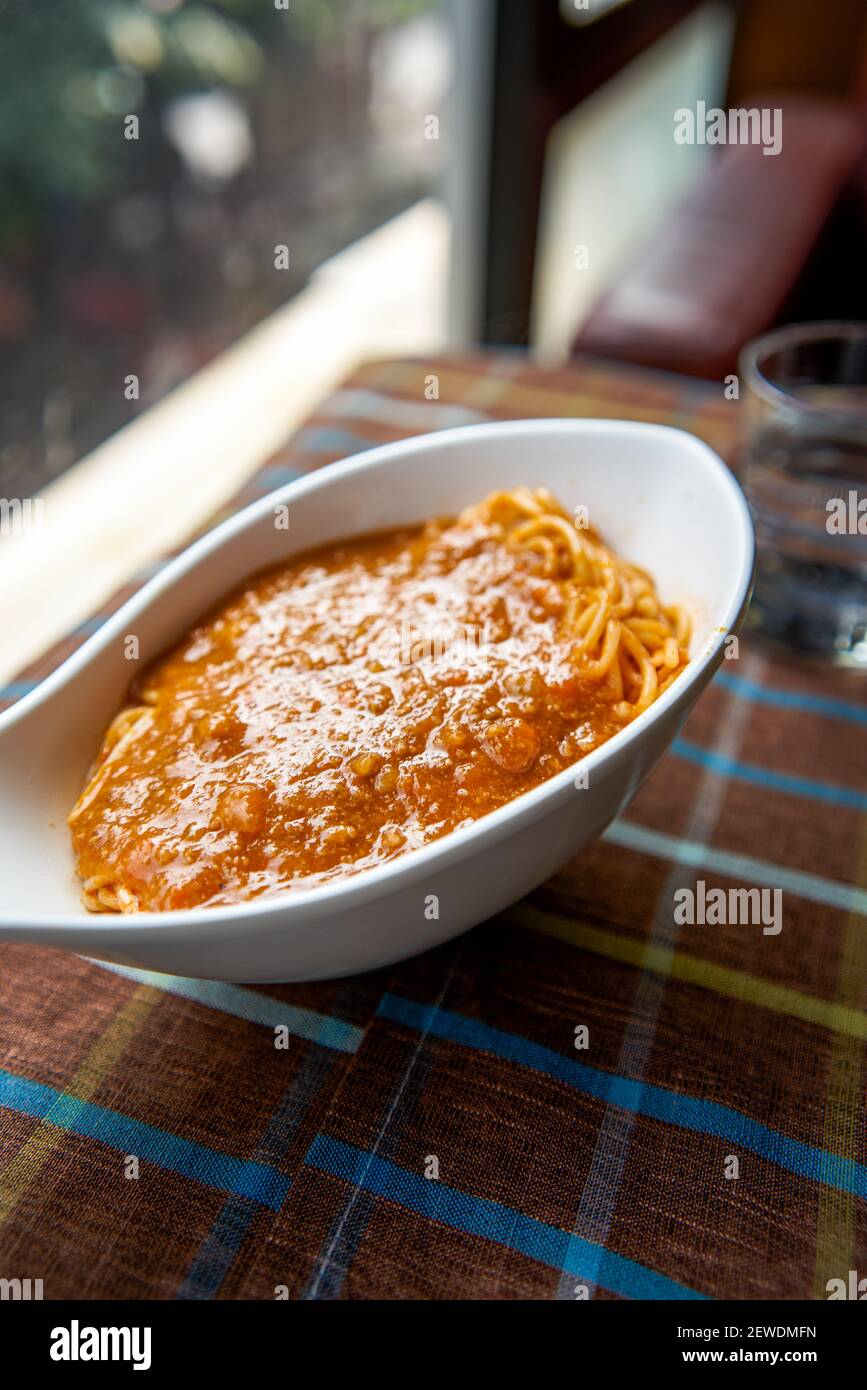 A tempting spaghetti with meat sauce, fork the pasta Stock Photo - Alamy
