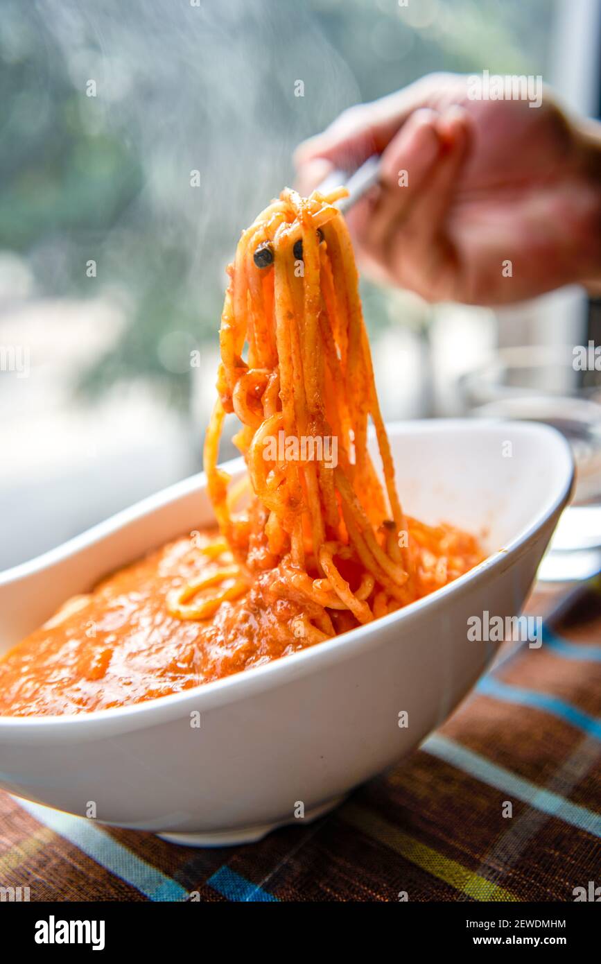 A tempting spaghetti with meat sauce, fork the pasta Stock Photo - Alamy
