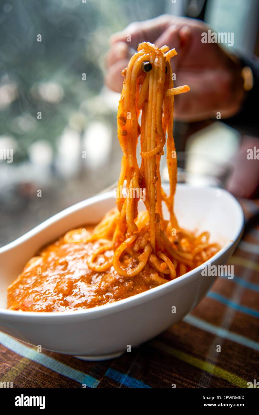 A tempting spaghetti with meat sauce, fork the pasta Stock Photo - Alamy