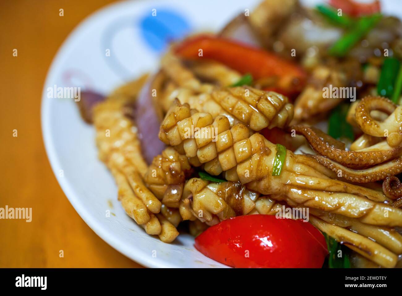 Chinese home cooking, fried squid with colored pepper Stock Photo - Alamy