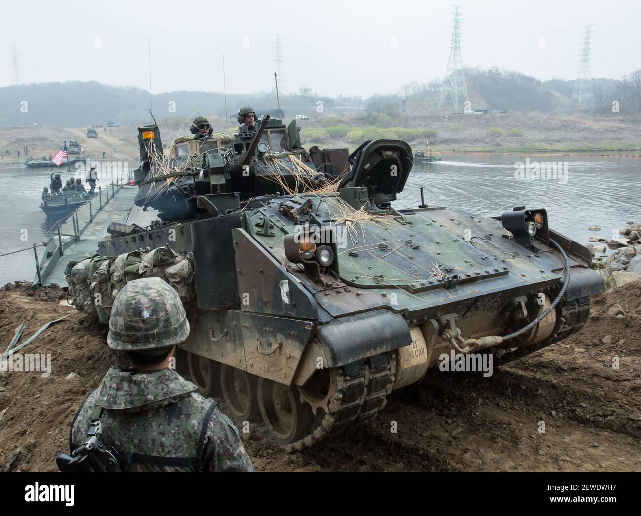 U.S. Army soldiers and M1A1 Bradley infantry fighting vehicle (IFV ...