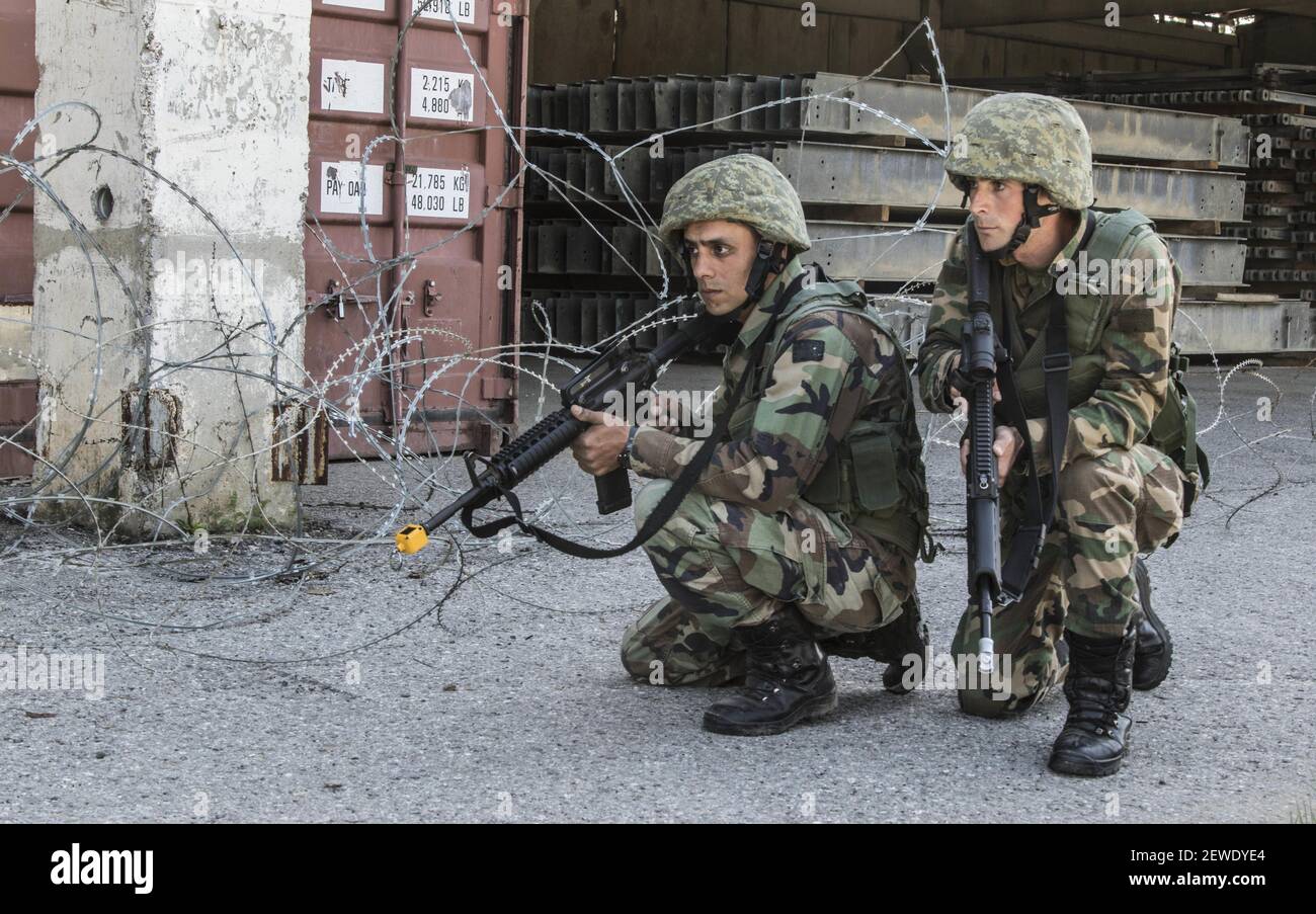 Kosovo Security Force (KSF) cadets prepare to assault a target during ...