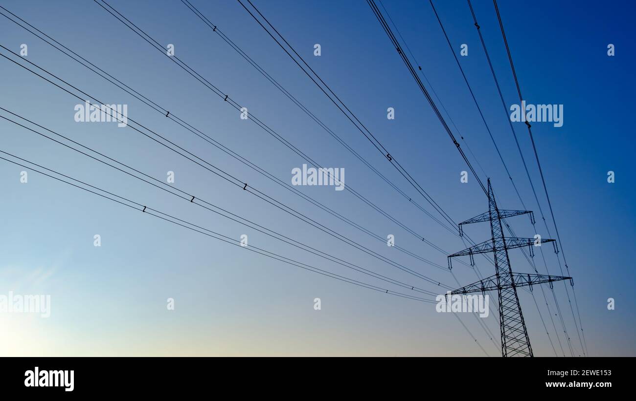 high voltage cable line, blue sky Stock Photo - Alamy