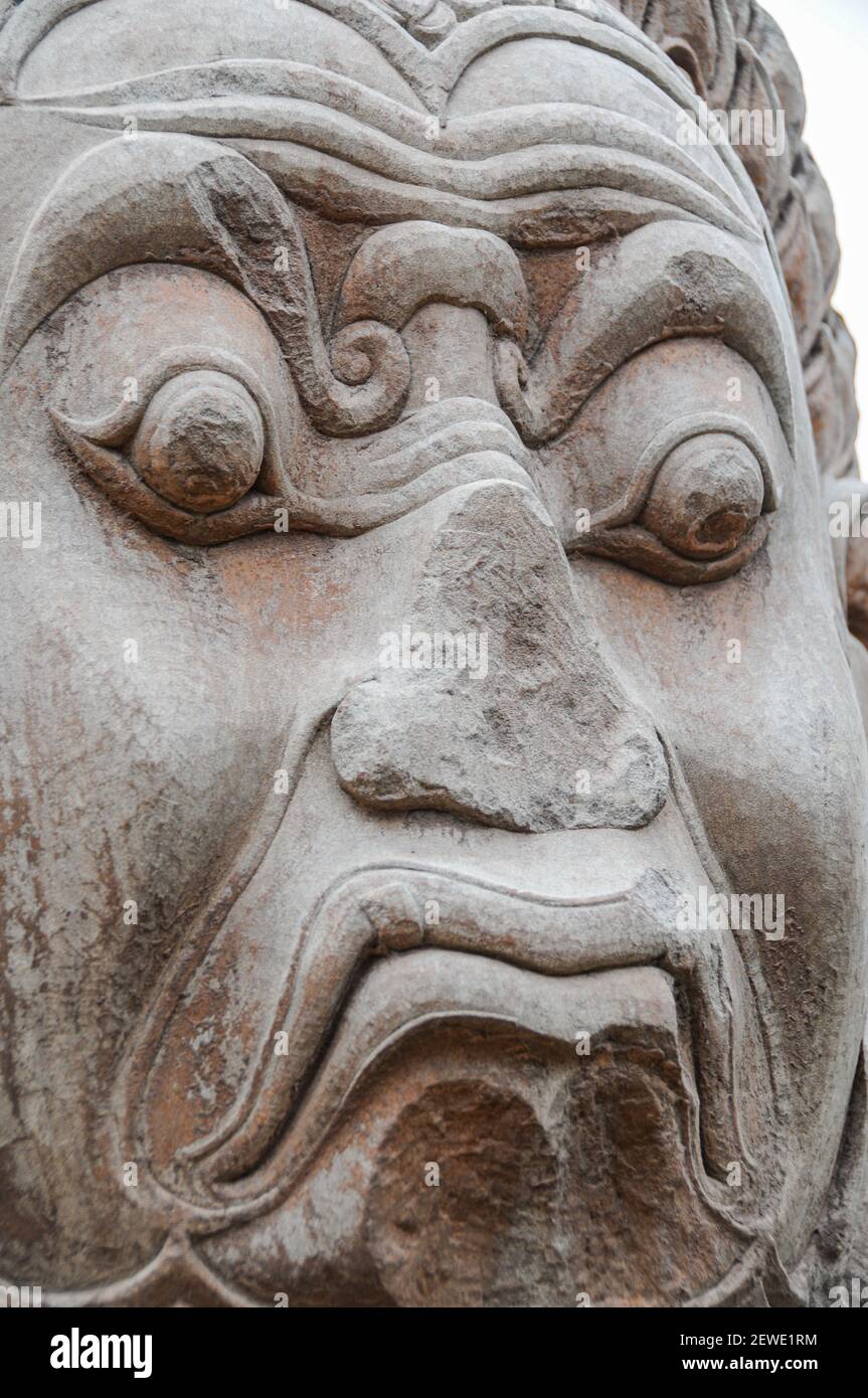The head of one of 54 demons that line the causeway leading to the ...