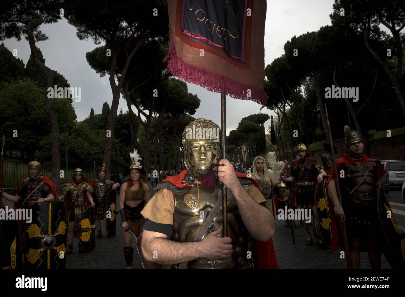 Actors dressed as ancient Roman march near the Coliseum in a ...