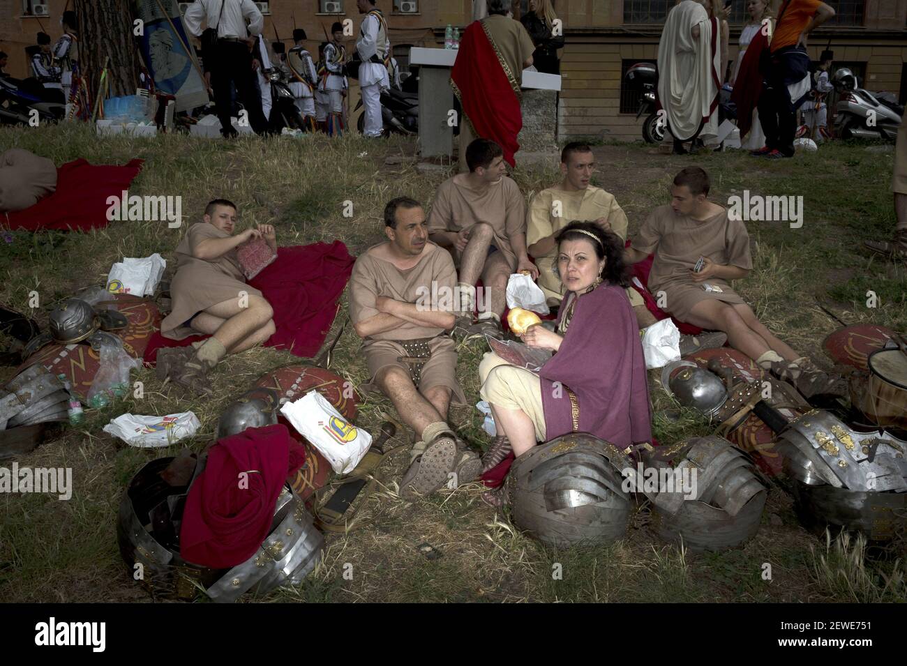 Actors dressed as ancient Roman are resting near the coliseum after the ...