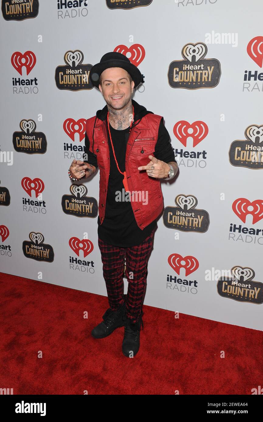 DJ Sinister poses on the red carpet backstage at the 2016 iHeartCountry ...
