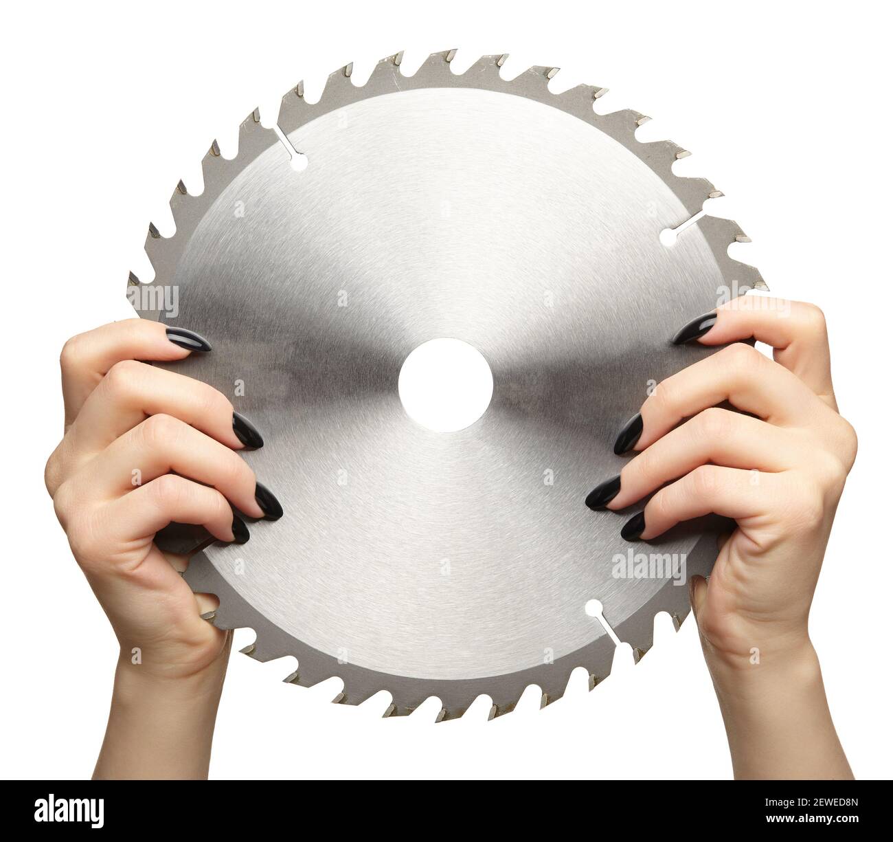 Female hands with black nails manicure with circular saw blade ...