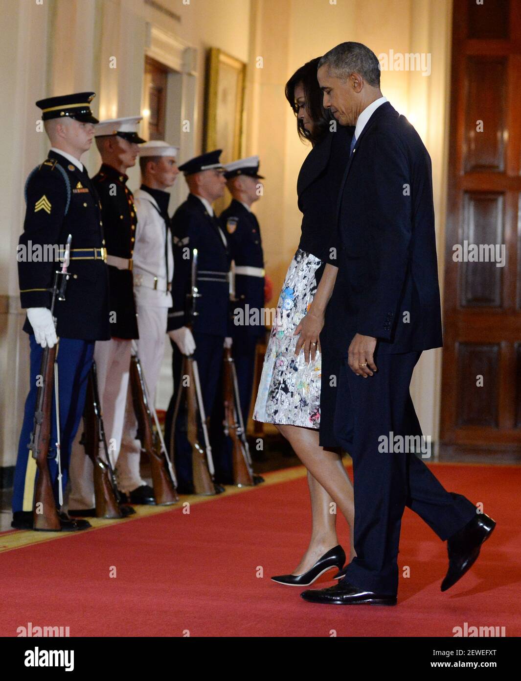 President Barack Obama and Michelle Obama walk to the Blue Room after ...