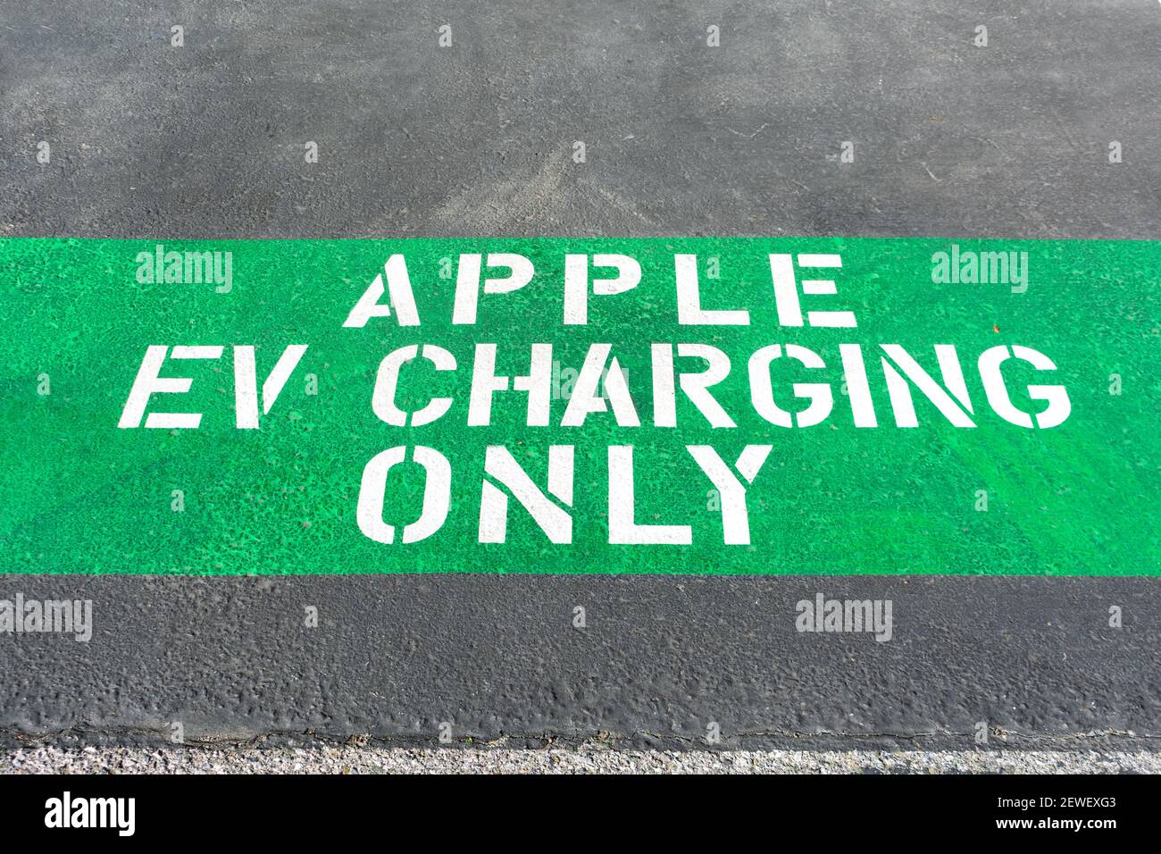 Apple EV Charging Only sign on dedicated parking spot for electrical ...