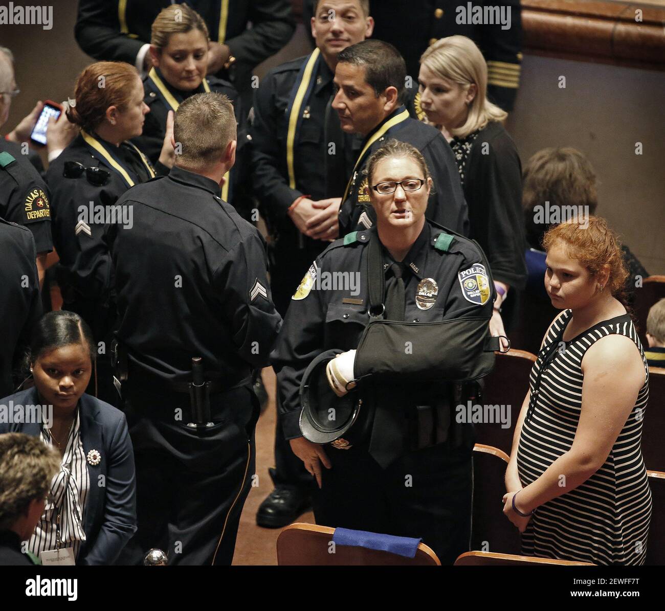 DART police officer Misty McBride, wounded in the attack, attends a ...