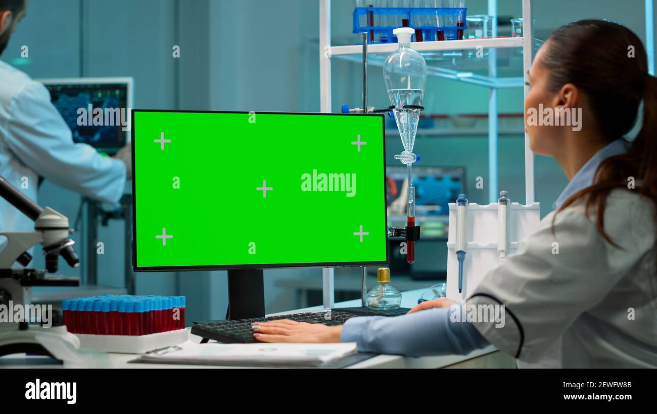 Researcher looking at chroma key display in modern equipped lab at ...