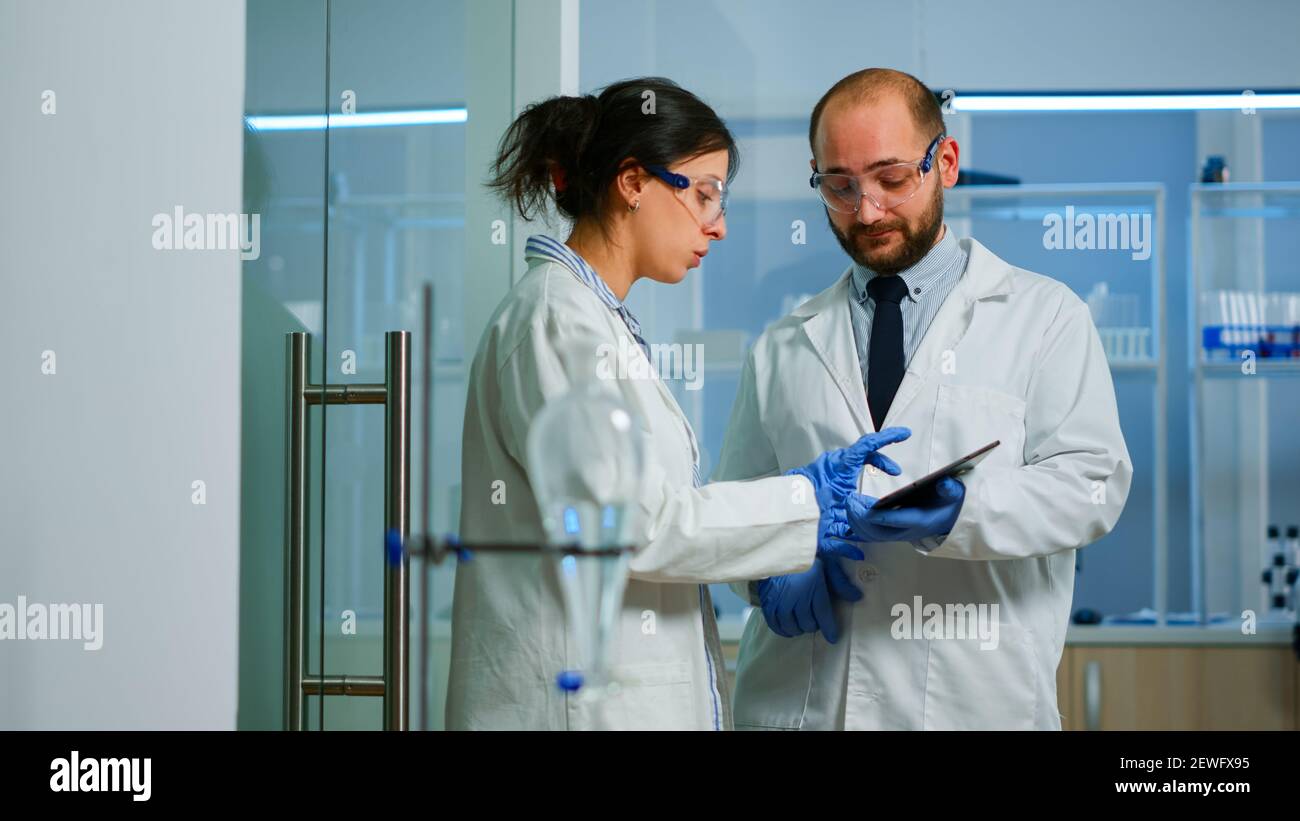 Scientist team meeting discusssing treatment hi-res stock photography ...