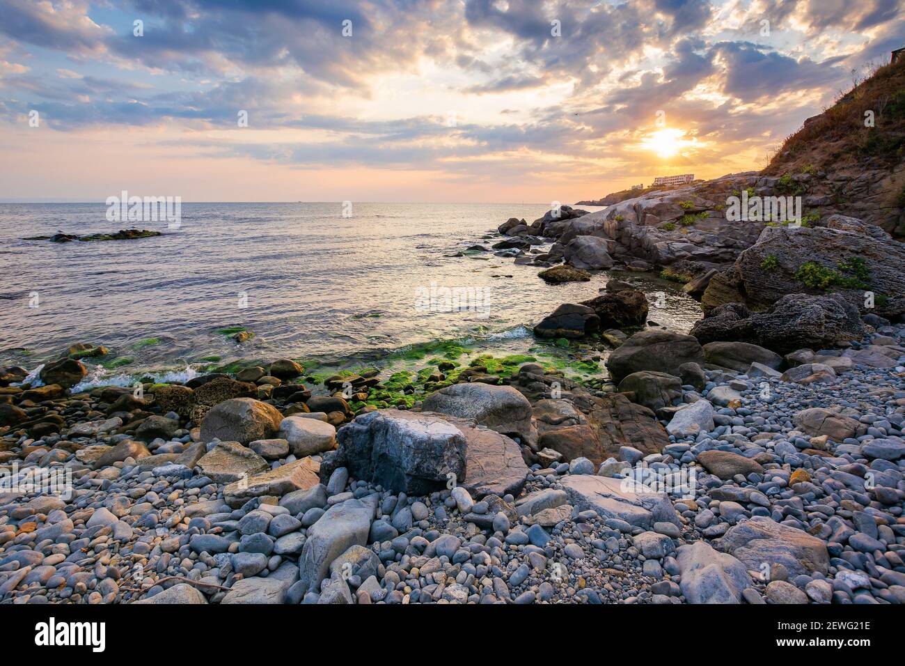 dramatic sunrise at the sea. beautiful seascape with clouds on the sky ...