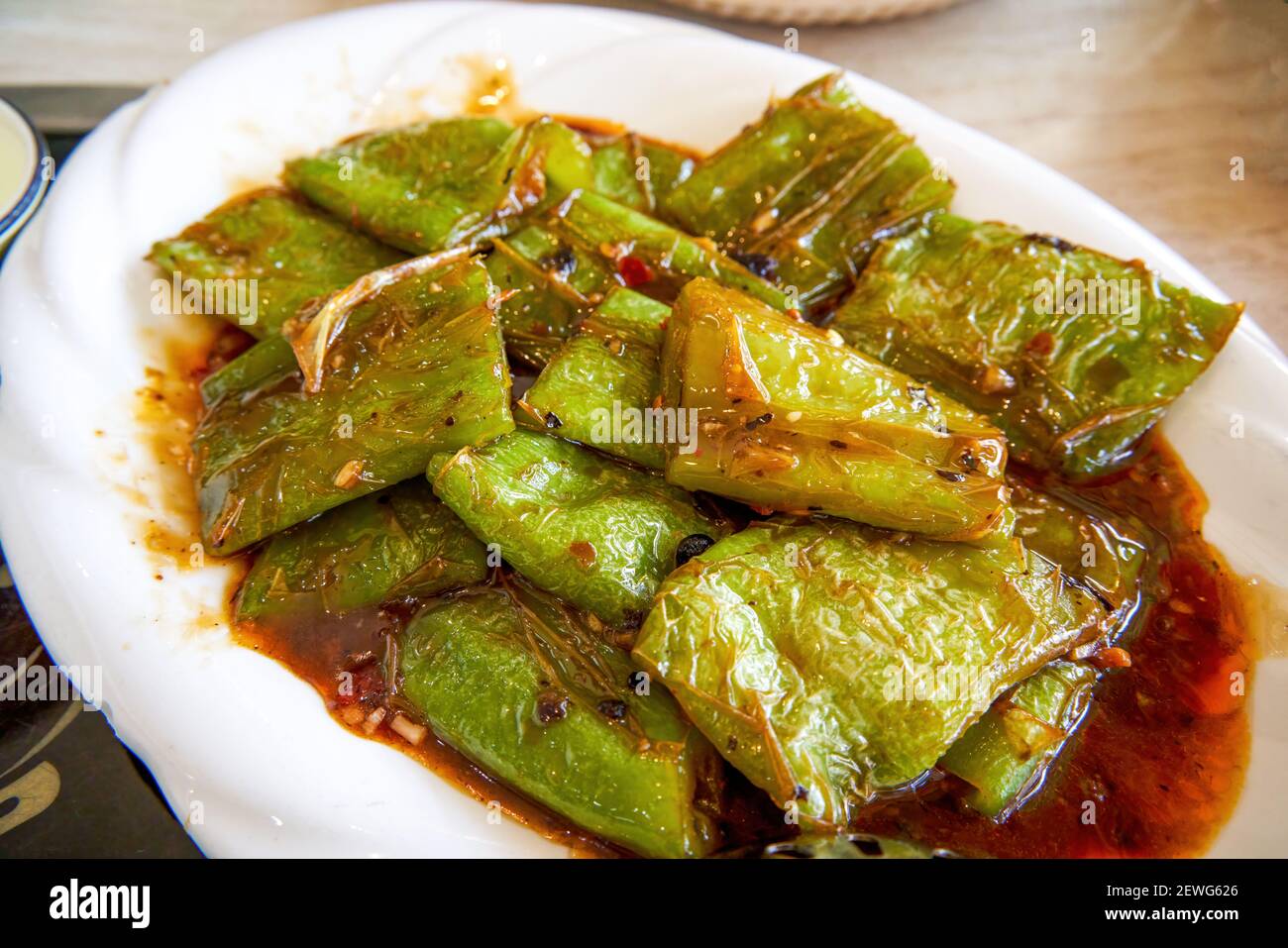 A delicious Chinese dish, fried tiger skin green peppers Stock Photo ...