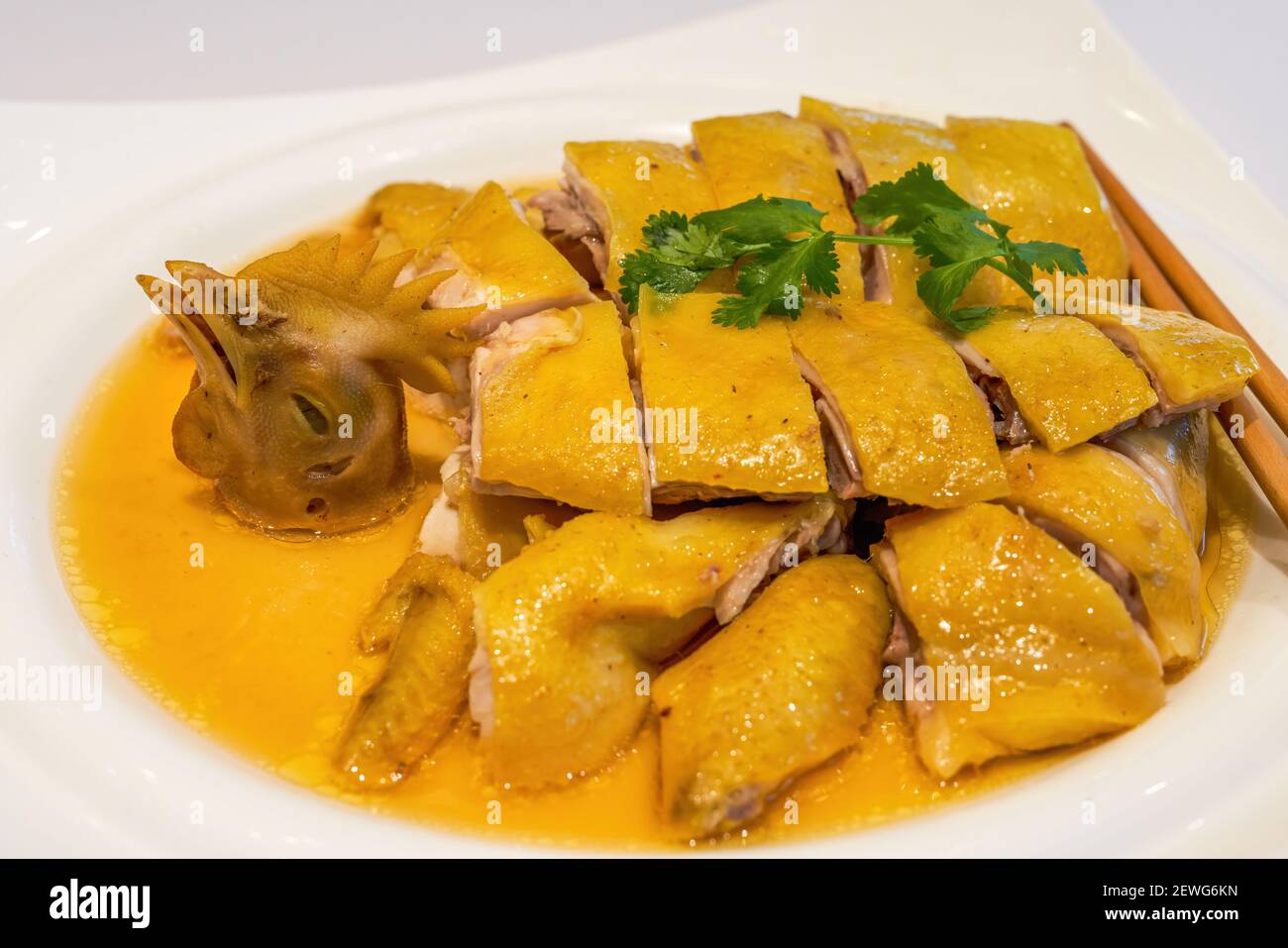 A classic Chinese Cantonese dish, white sliced chicken, white boiled ...