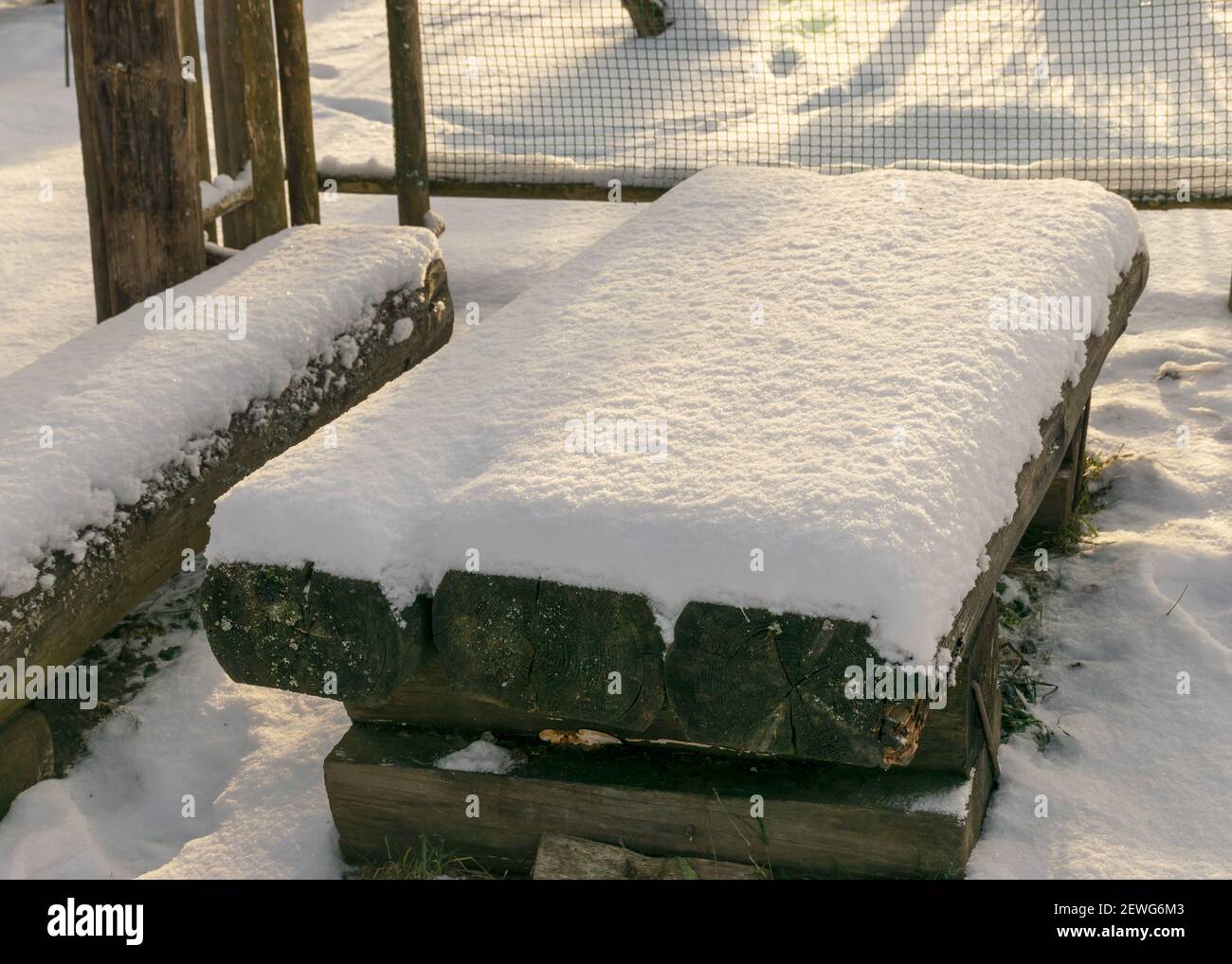 photo of snow - covered table, winter day Stock Photo - Alamy