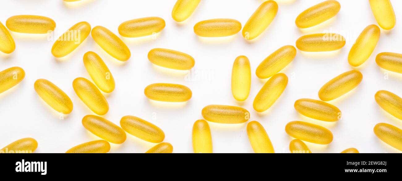 Omega 3 capsules on white background Fish oil Yellow softgels Vitamin D ...