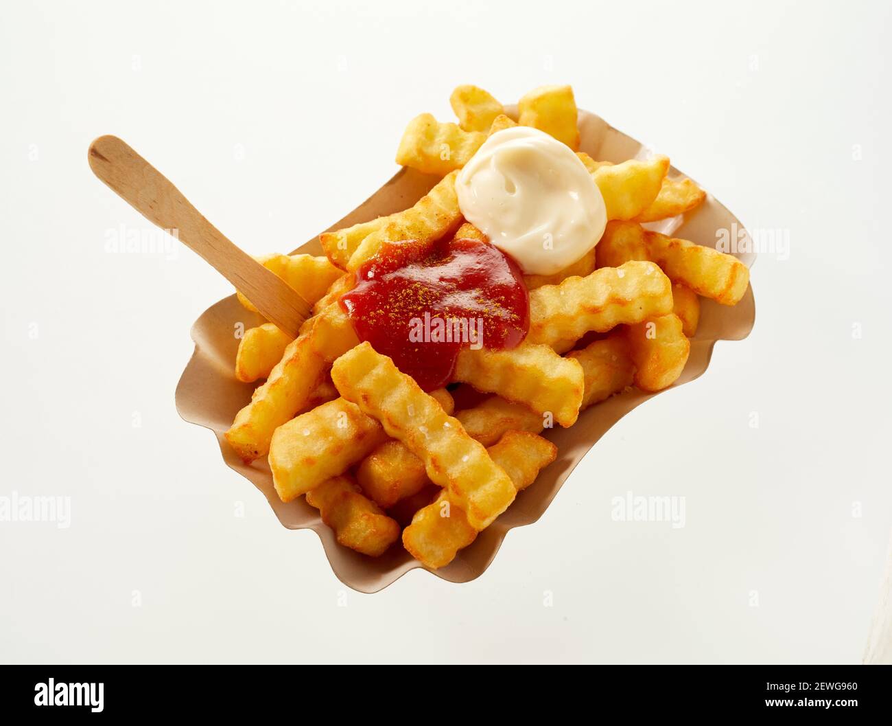 From above of delectable golden fast food fried potato sticks and ...