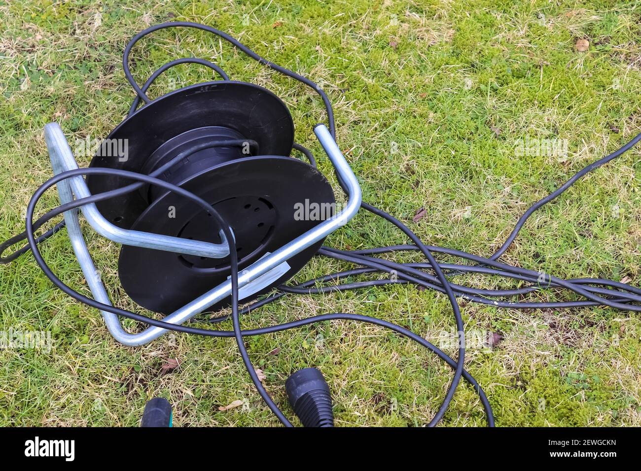 A black wire organizer device to help you wrap wires around it put on a ...