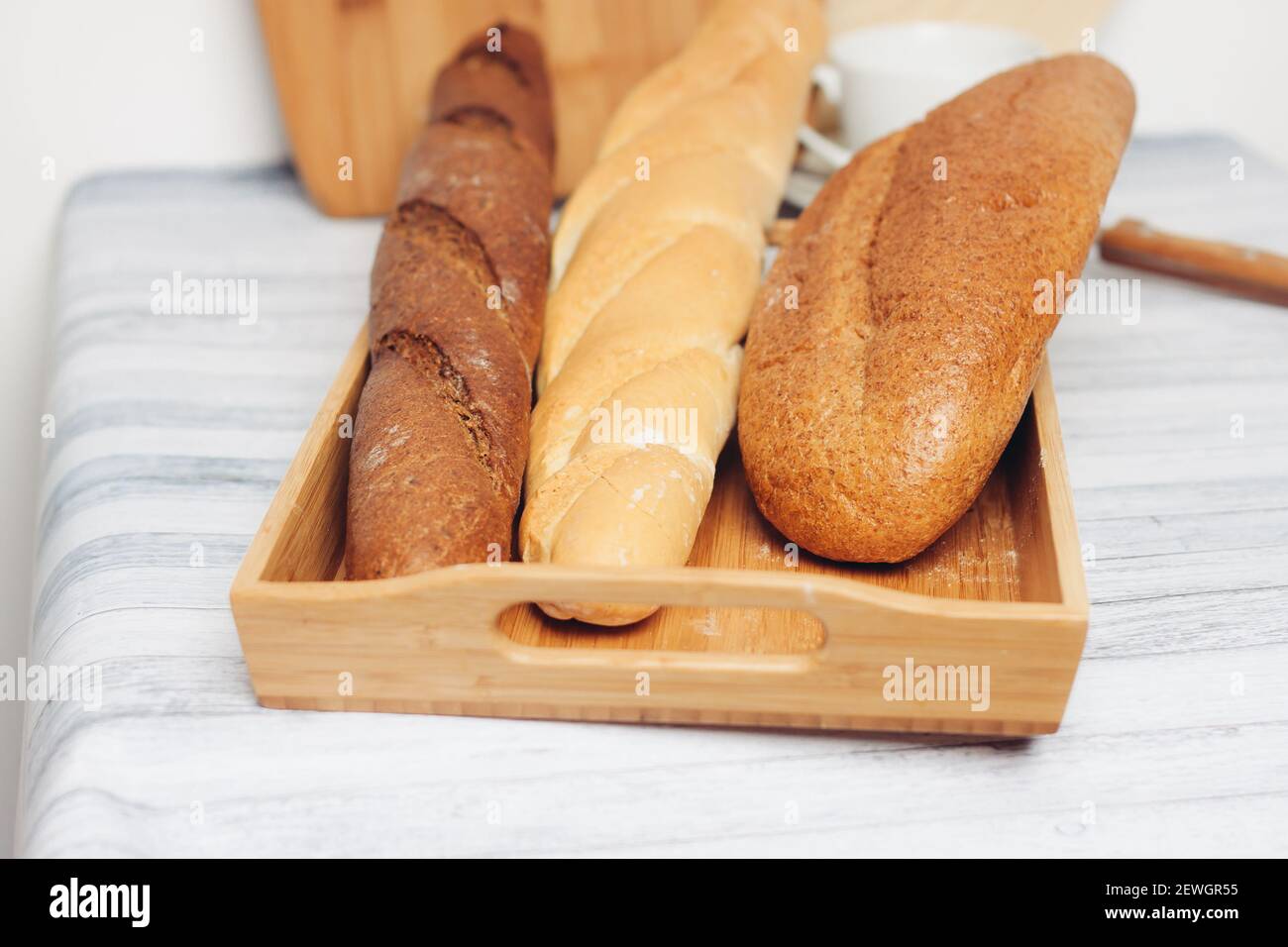 different types of loaves cutting board kitchen cutting Stock Photo - Alamy