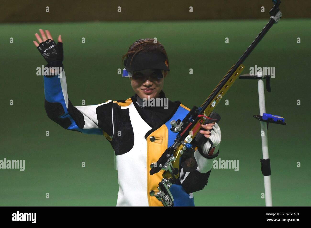 Du Li of China waves to the audience after the women's 50m rifle 3 ...