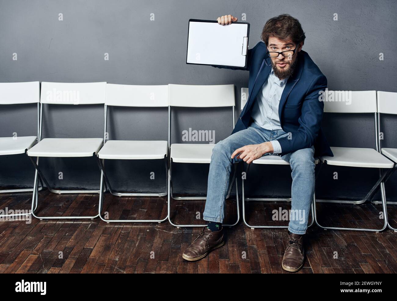 man sitting on chair waiting job interview resume training professional ...