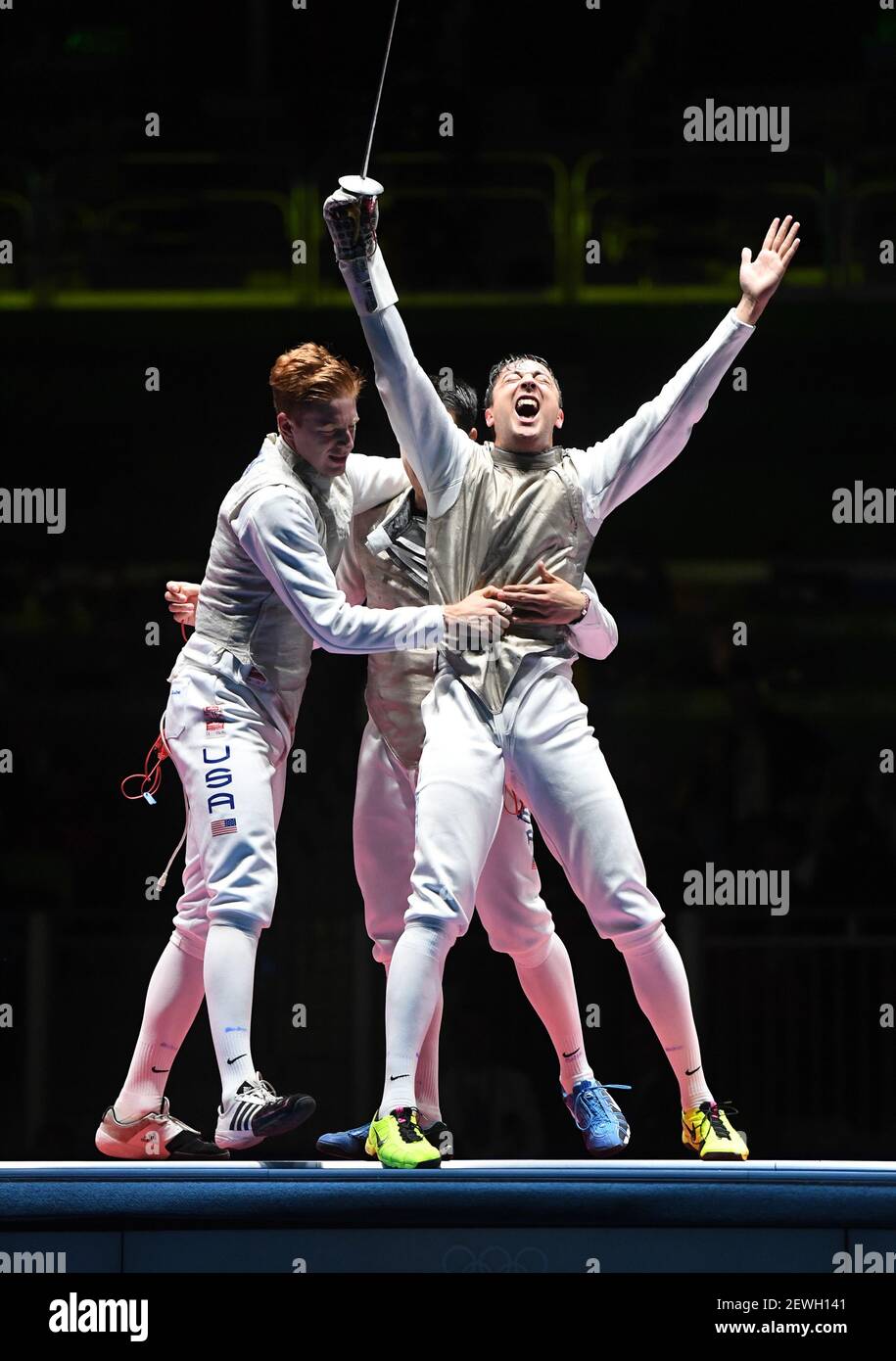 U.S. fencer Alexander Massialas, right, celebrates with teammates Race ...