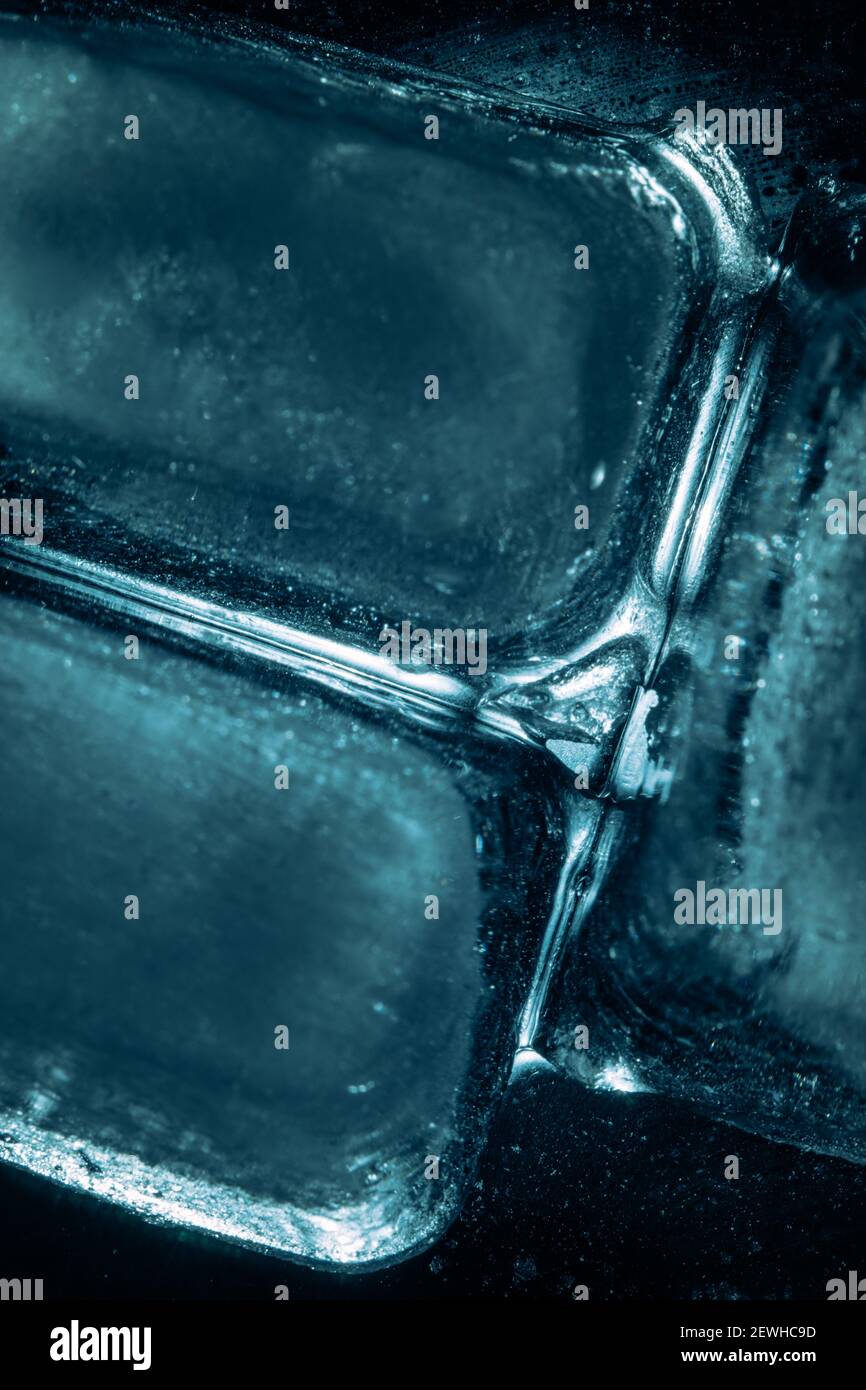 A closeup shot of ice cubes under blue light Stock Photo - Alamy