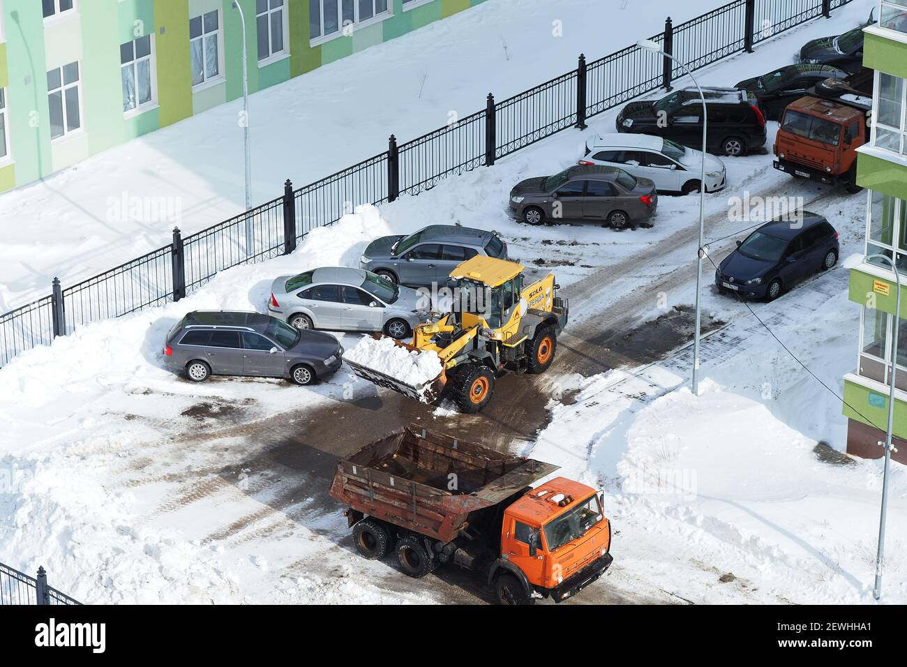 Snow removal equipment. Cleaning of streets and yards from snow. A dump ...