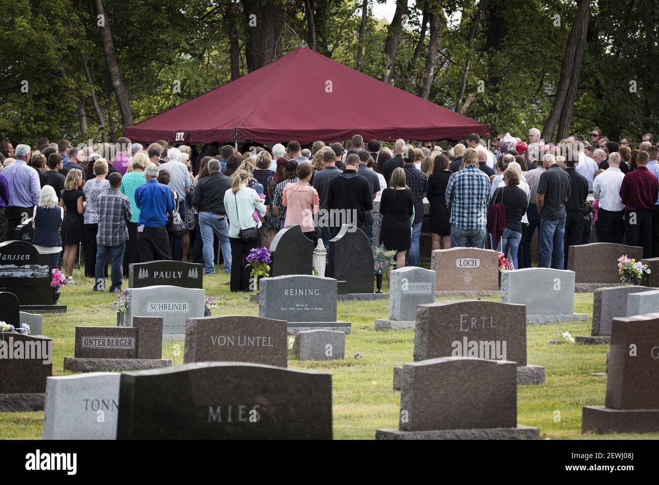 Mourners crowd the burial service for five-year-old Alayna Ertl on Aug ...