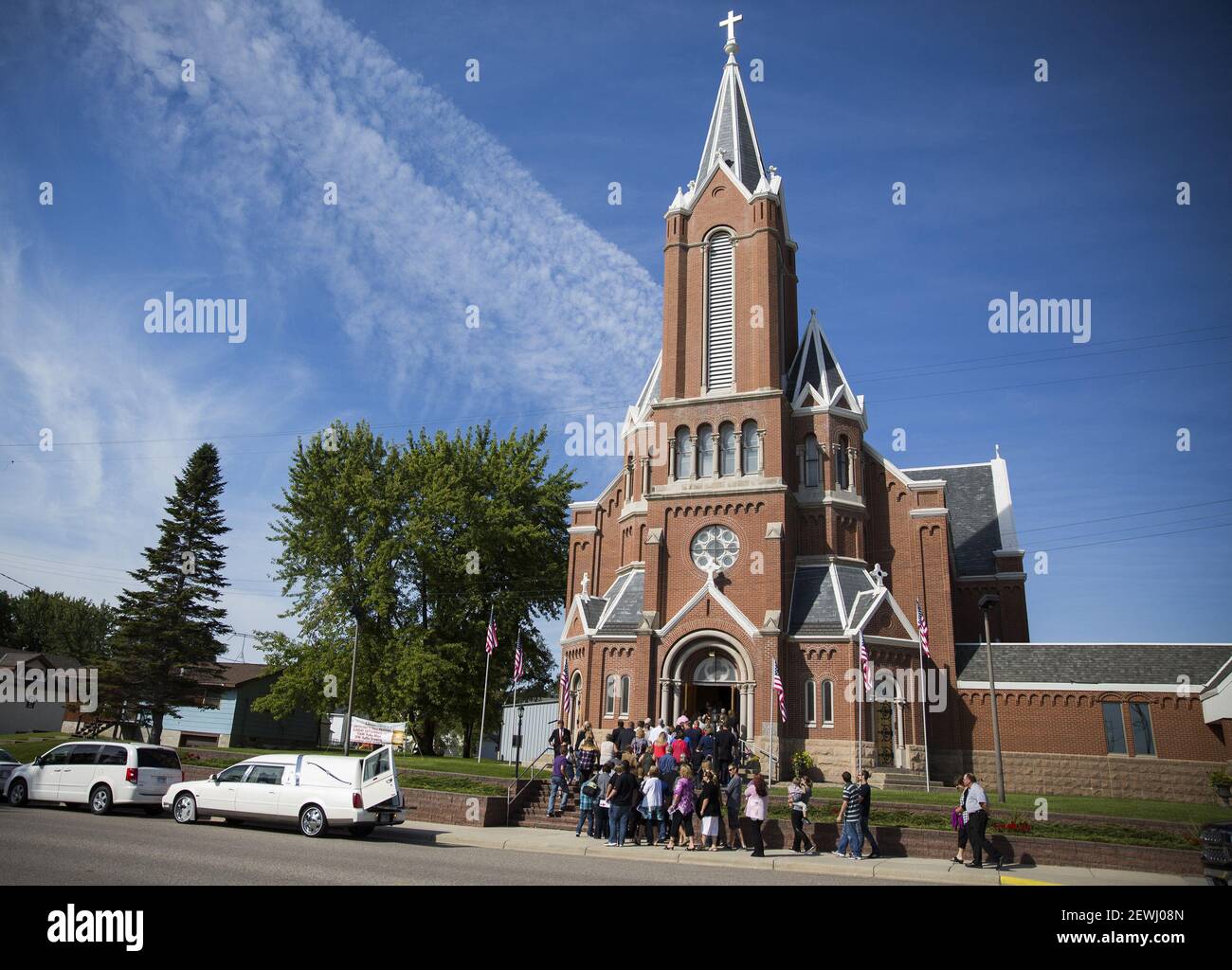 Mourners file into St. Anthony Catholic Church for the funeral of five ...